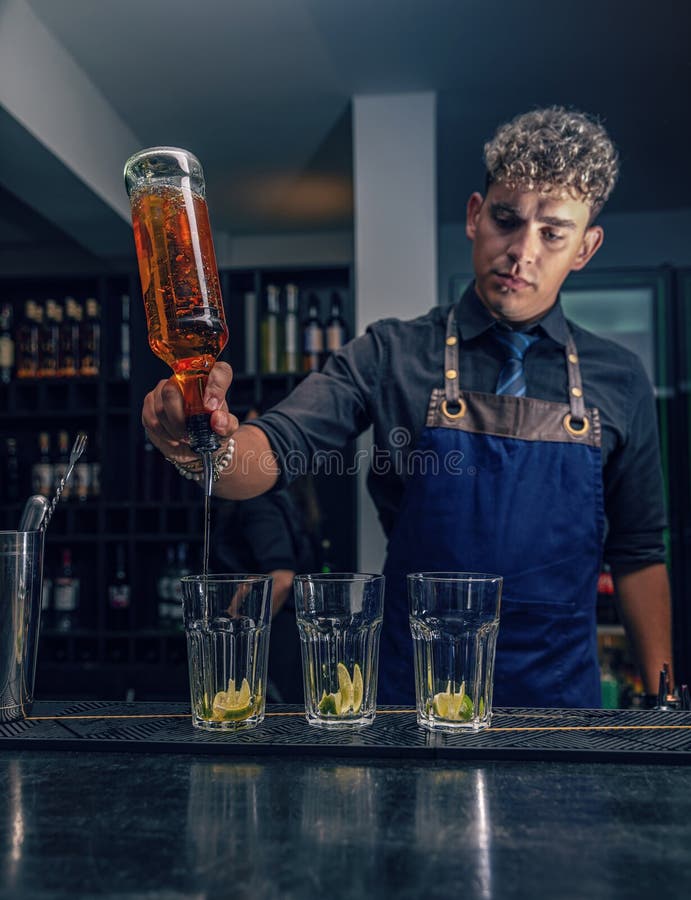 Bartender making cocktail stock photo. Image of liquor - 301369360