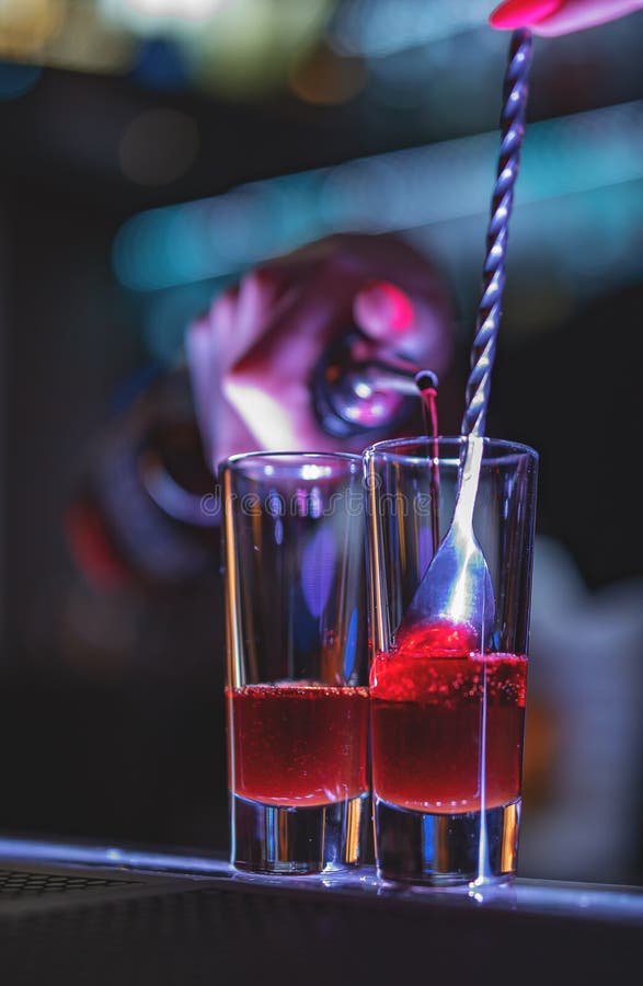 Bartender Making Collection of Colorful Shots. Set of Cocktails at the ...
