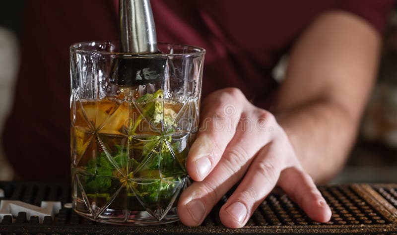 Bartender Hand Holding a Glass of Cocktail Stock Image - Image of fresh ...