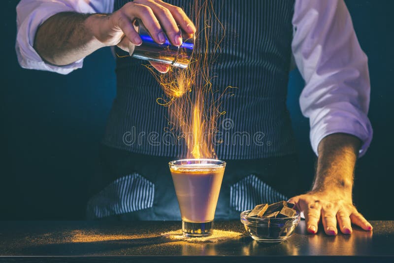 Bartender Making Sparkling Baileys Comet Cocktail on Fire Stock Image ...