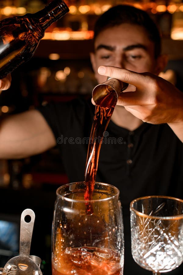Bartender Masterfully Pours Strong Alcohol from Steel Jigger into ...