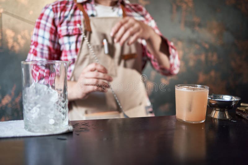 Bartender Mixing a Cocktail at the Bar. Stock Photo - Image of liquid ...