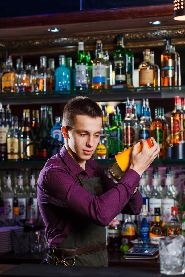 The Bartender Mixing Cocktail Stock Image - Image of bottle, indoors ...