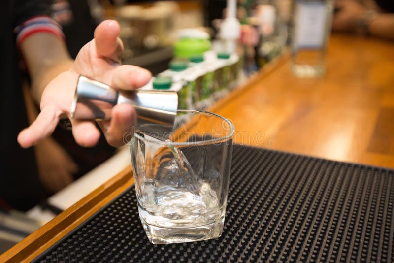 Bartender Mixing Cocktails for Customers on Bar Counter Stock Photo ...
