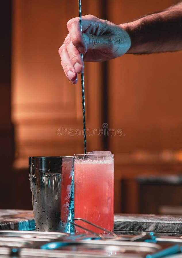 Bartender at Nightclub Preparing Cocktails with Bar Equipment Stock ...