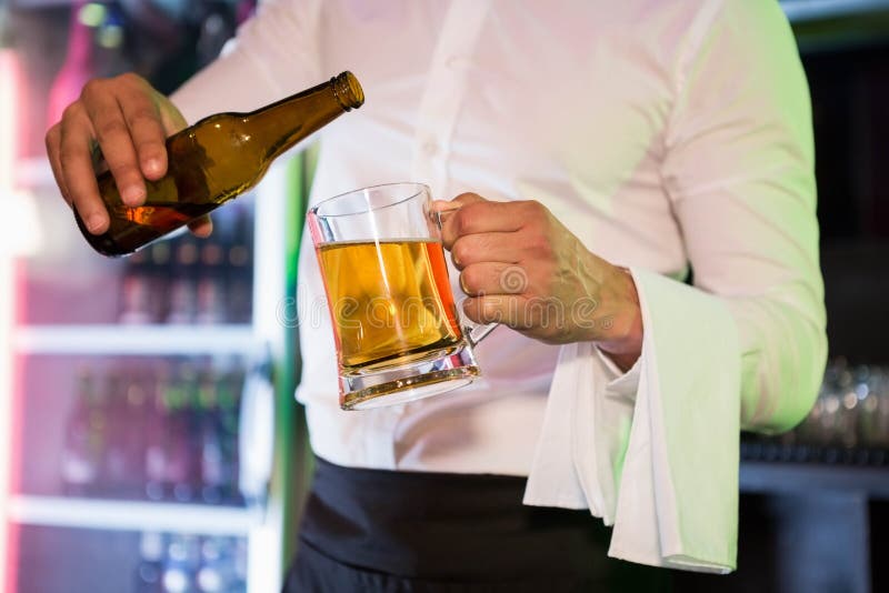 Bartender Pouring Beer in a Pint Stock Photo - Image of expertise ...