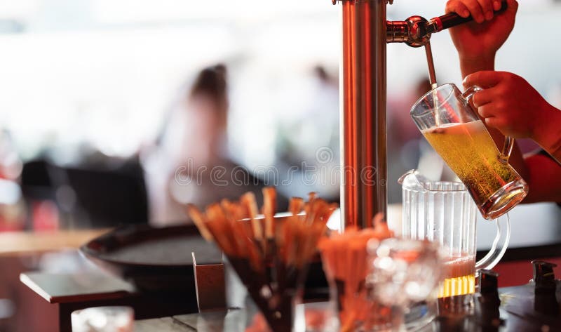 Bartender Pouring Beer from Tap in Busy Bar Stock Image - Image of hour ...