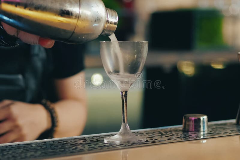 Bartender Pouring Cocktail at Bar Counter Stock Image - Image of making ...