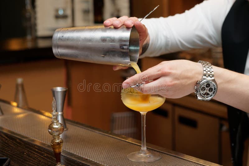 Bartender is Pouring Cocktail from Shaker Stock Image - Image of ...