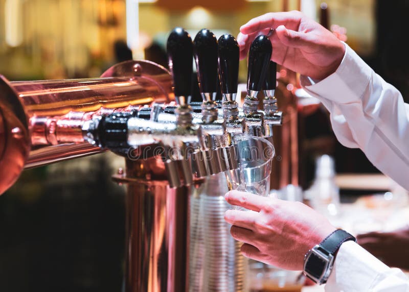 Bartender Pouring Draft Beer in the Bar, Barman Hand at Beer Tap ...
