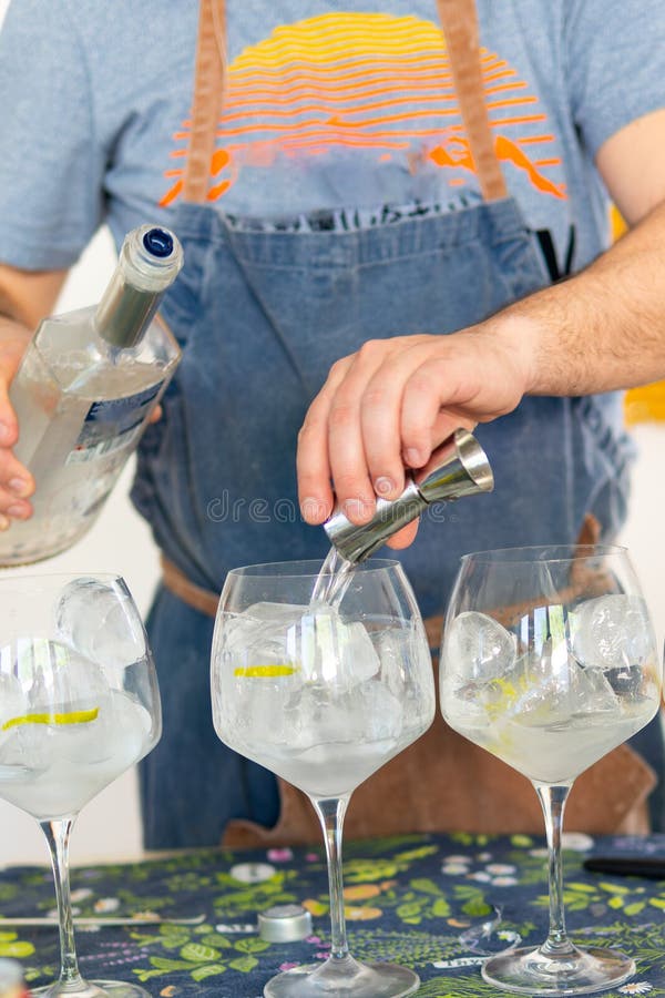Bartender Pouring Gin with the Jigger Alcohol Measuring Device into ...