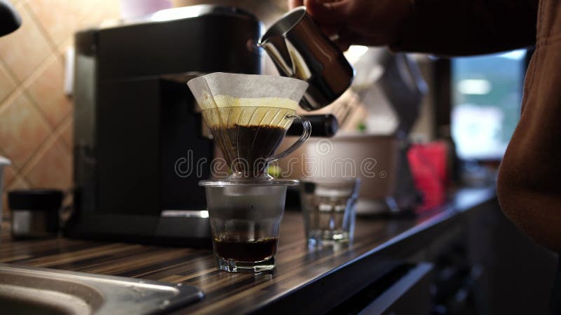 Bartender Pouring Water into a Pour Over Filter Coffee Maker Stock ...