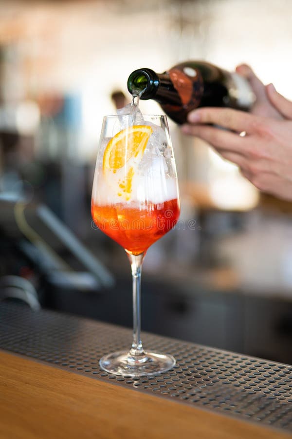 The Bartender Prepares a Beautiful Alcoholic Cocktail at the Bar ...