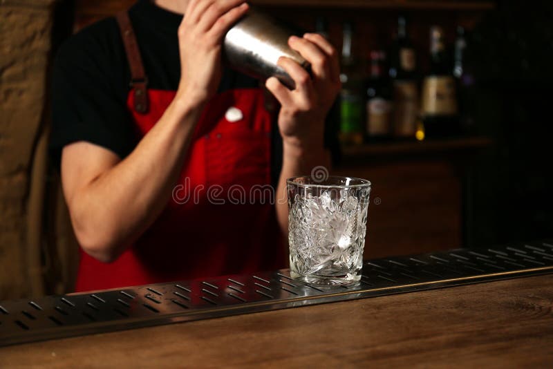 Bartender Preparing Alcoholic Cocktail at Bar Counter, Focus on Glass ...