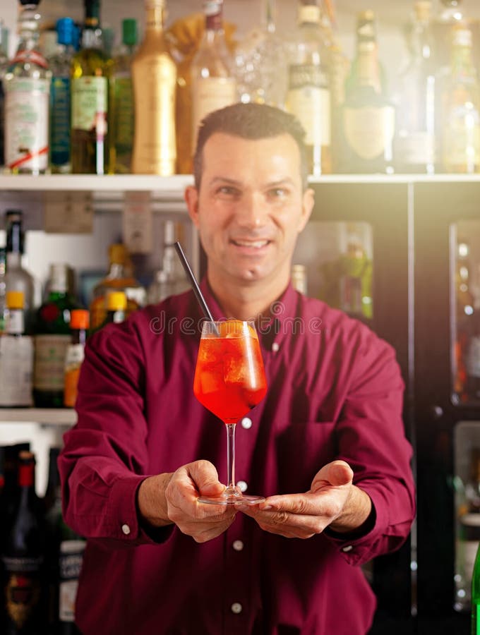 Bartender Presenting Cocktail at Bar Stock Image - Image of leisure ...