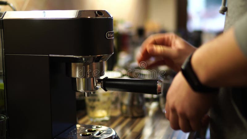 Bartender Puts a Cone with Ground Coffee into the Coffee Machine on the ...