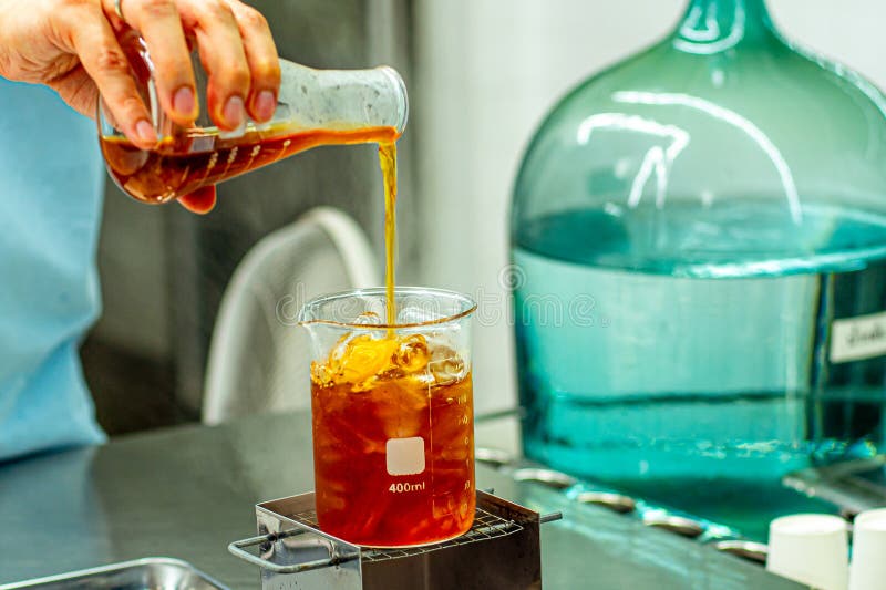 Bartender S Frozen Alchemy: Crafting Ice Beverages in Lab Beaker Glass ...