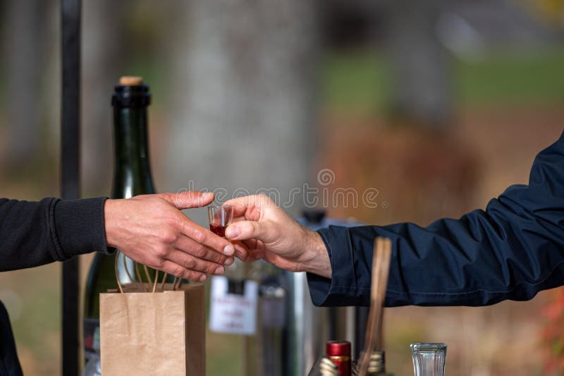 Bartender Serves a Glass of Alcohol To a Customer, Hand Close-up Stock ...