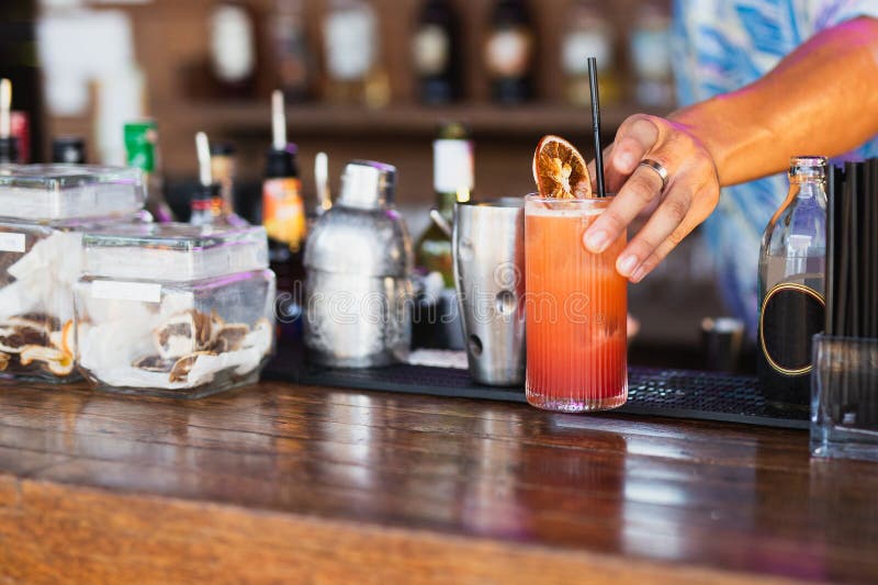 Bartender Serves a Ready Made Alcoholic Cocktail at the Bar. Stock ...