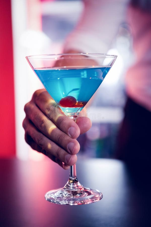 Bartender Serving a Blue Martini Stock Image - Image of indoors, luxury ...