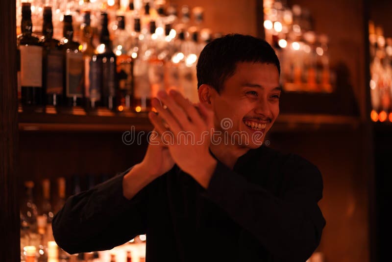 Bartender shaking a shaker stock photo. Image of talking - 243964636