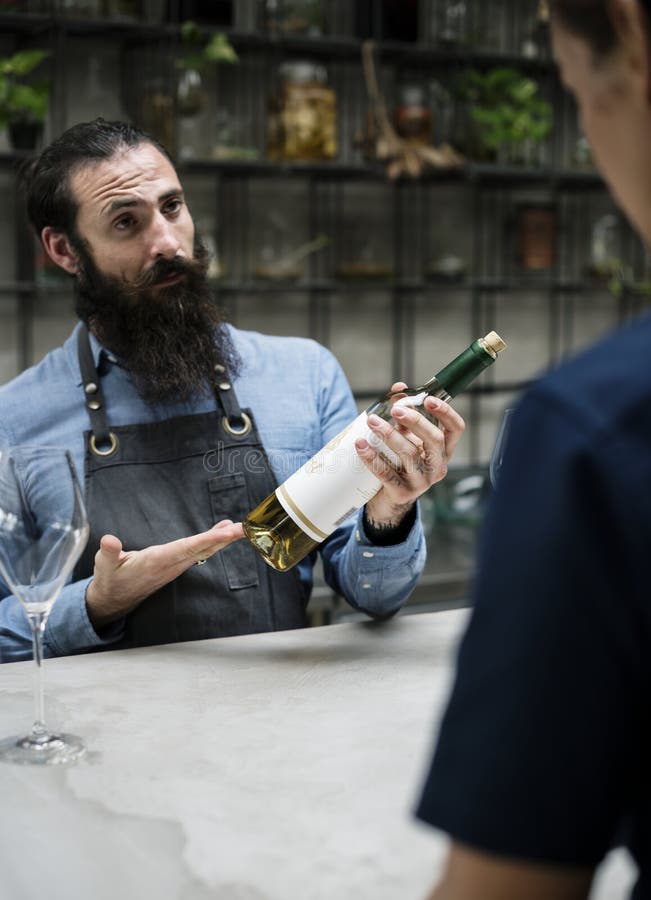 Bartender Showing a Wine To Customer at the Bar Stock Image - Image of ...