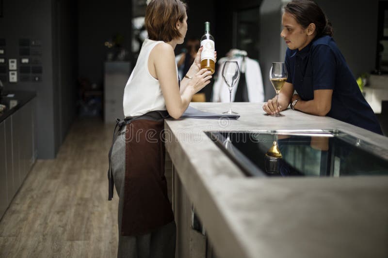 Bartender Showing a Wine To Customer at the Bar Stock Image - Image of ...