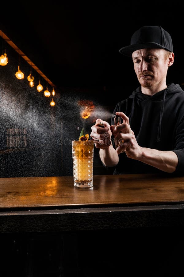 Bartender Spraying and Fire Whiskey in Alcoholic Cocktail at Bar ...