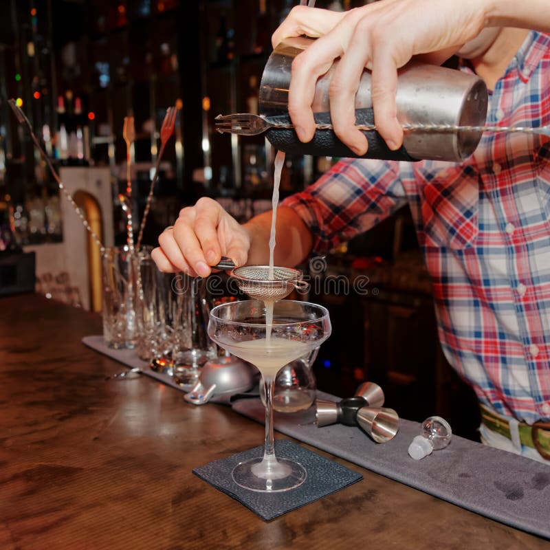 Bartender is Straining Drink in Glass Stock Photo - Image of drink ...