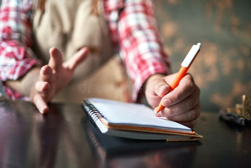 Bartender Taking Notes in a Notebook. Close-up. Stock Image - Image of ...