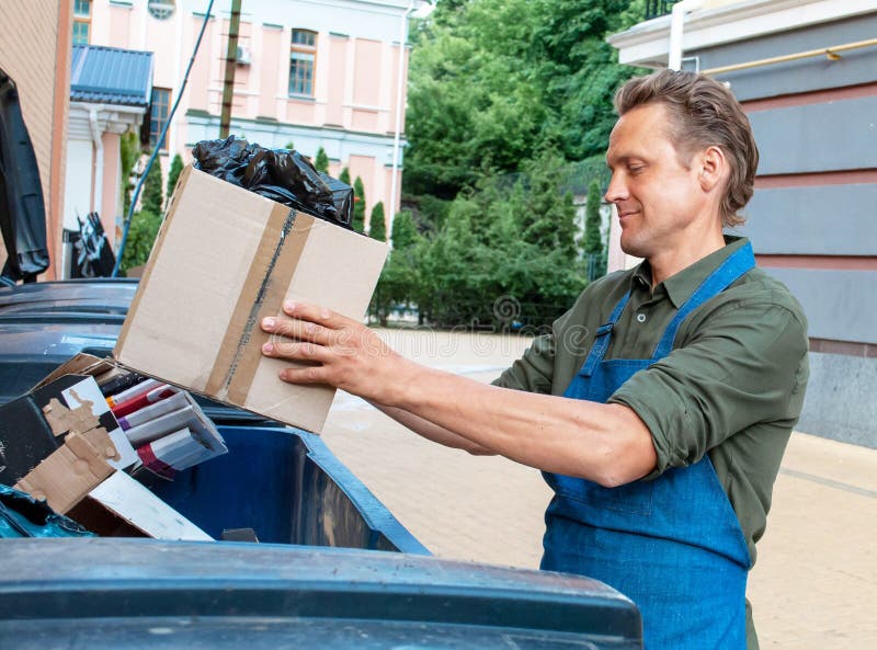 Bartender is Taking Out Big Paper Box into Container. Man in Apron Puts ...