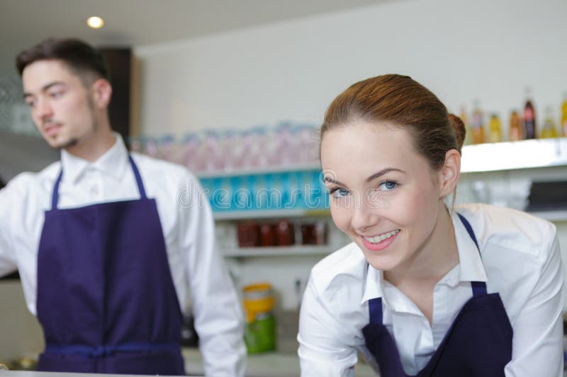 Bartender and Waitress in Bar Stock Photo - Image of smile, manual ...