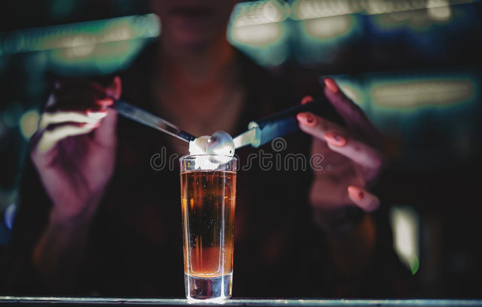 Bartender Hand Making Cocktail at the Bar Stock Photo - Image of double ...