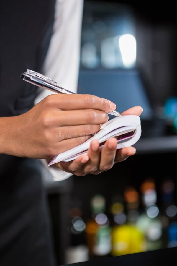 Bartender Writing Down an Order Stock Image - Image of restaurant ...