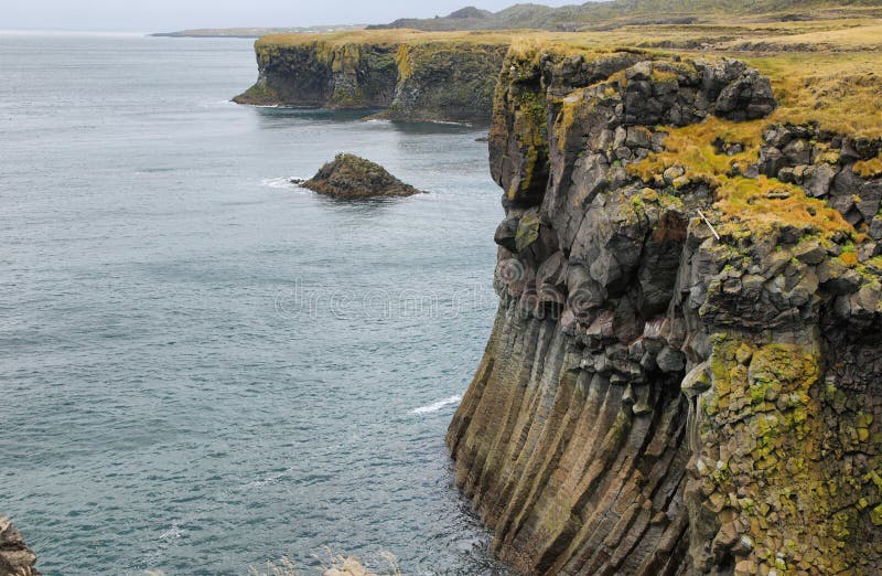 Basalt Cliffs at Arnarstapi Stock Photo - Image of grass, shore: 49803980