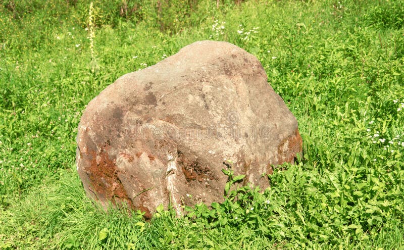 Basalt Rock in the Green Grass Stock Photo - Image of shape, hard: 76240726