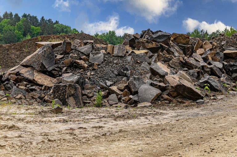 Basalt Stones in a Quarry. Columnar Basalt Quarry in Summer Stock Photo ...