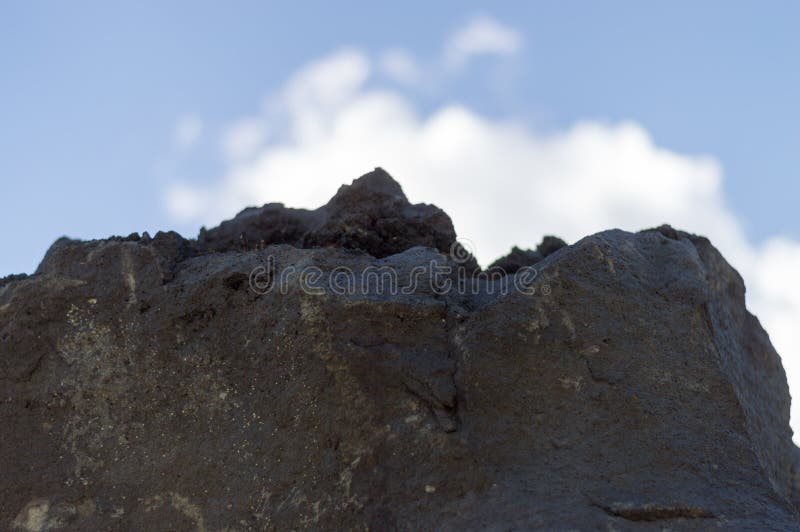 Basaltic Rock Structure among Red Volcanic Soil Stock Photo - Image of ...