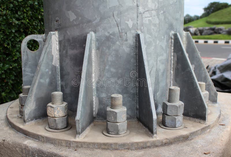 Metal Pillar Fasten To Basement with Anchor Bolts and Nuts. Supporting ...