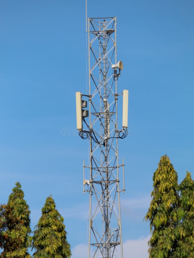 The Base Transceiver Station Stands Red Behind the Tree Stock Photo ...
