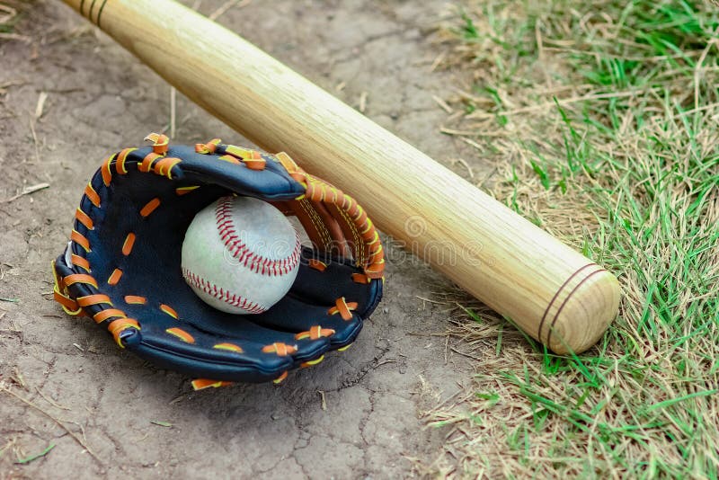 A Baseball Bat Concept with Ball Outdoors in the Park on the Field ...