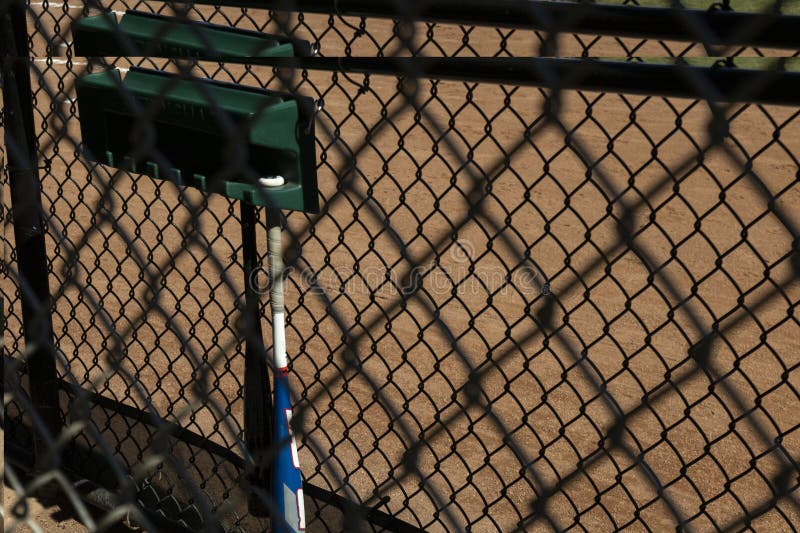 Baseball Bat in Front of Grids on the Playground Stock Image - Image of ...