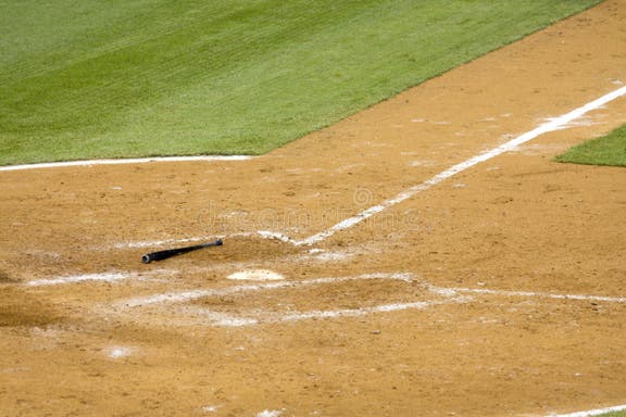 Baseball bat on ground stock photo. Image of ground, batter - 5302200