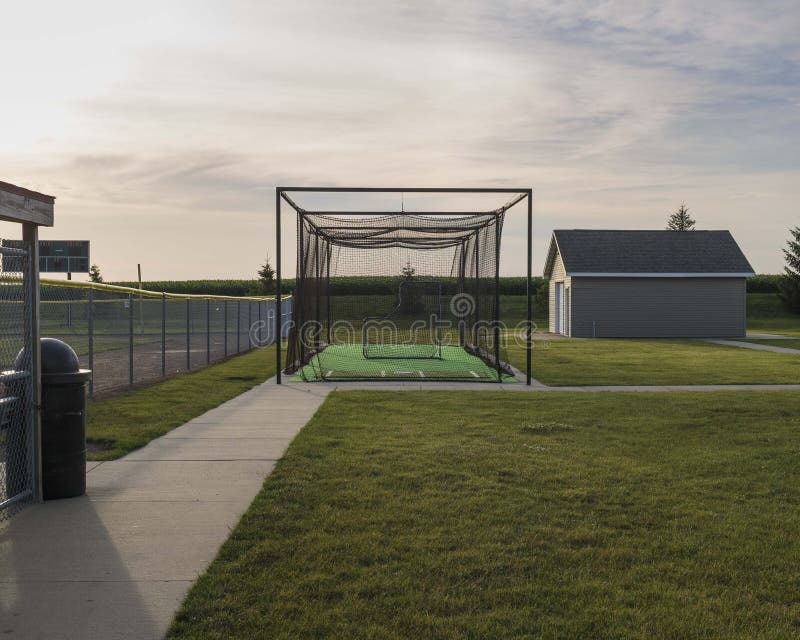 A Baseball Batting Cage on the First Base Side of the Field Stock Image ...