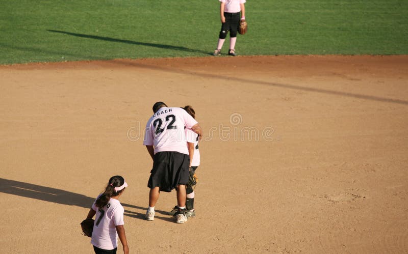 Baseball Coach Helping a Player Stock Photo - Image of footprints ...