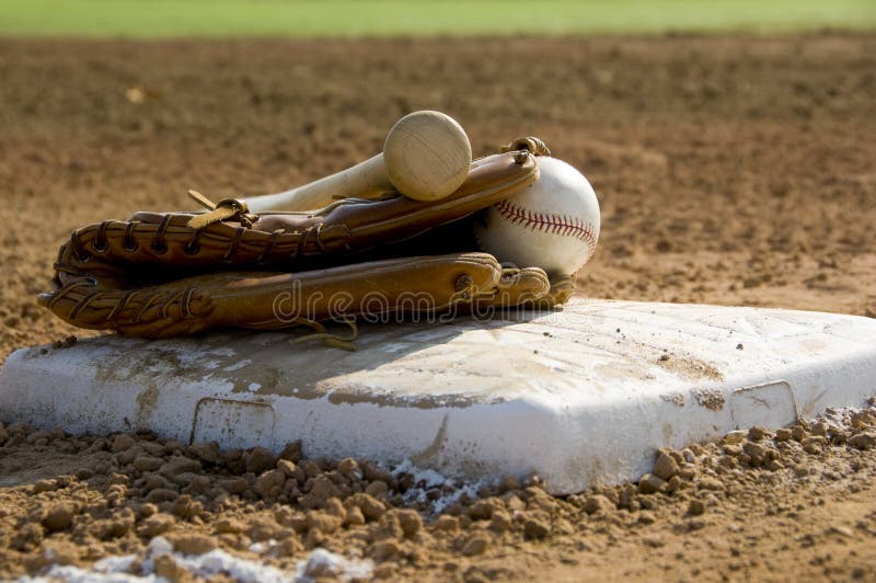 Baseball equipment on base stock photo. Image of tools - 6917132