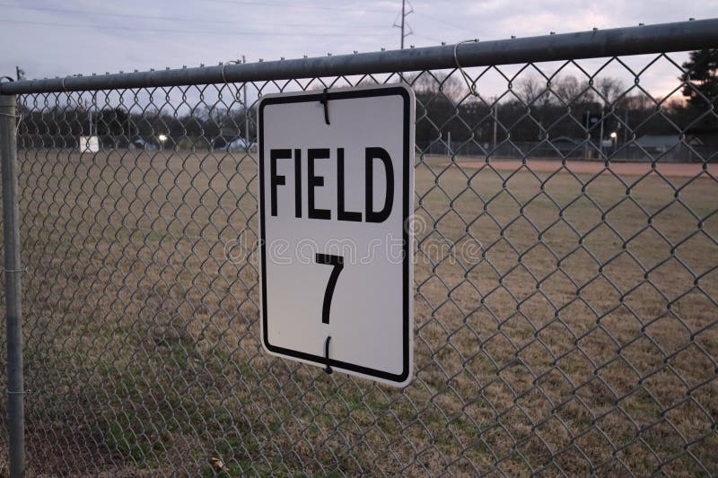 Baseball Field Sign on a Chain Link Fence Stock Photo - Image of white ...
