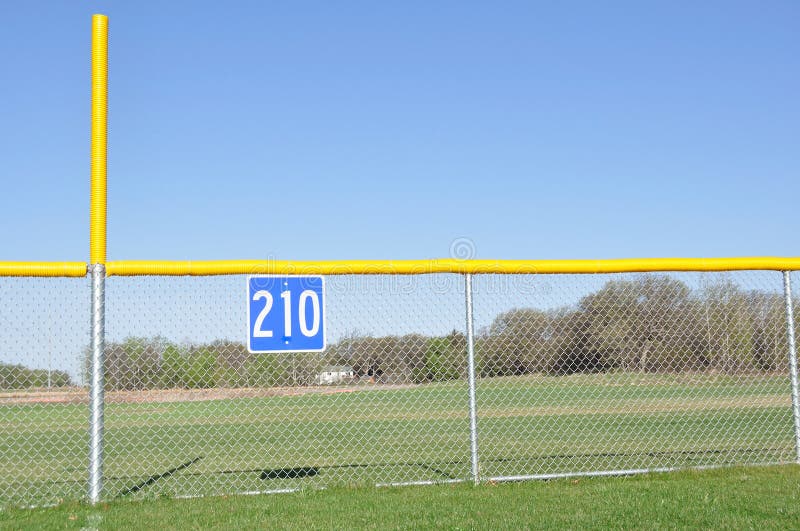 Baseball Foul Pole and Outfield Fence Stock Image - Image of grass ...