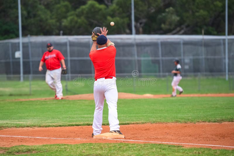 Baseball Game, First Baseman Catching the Ball Thrown from the ...