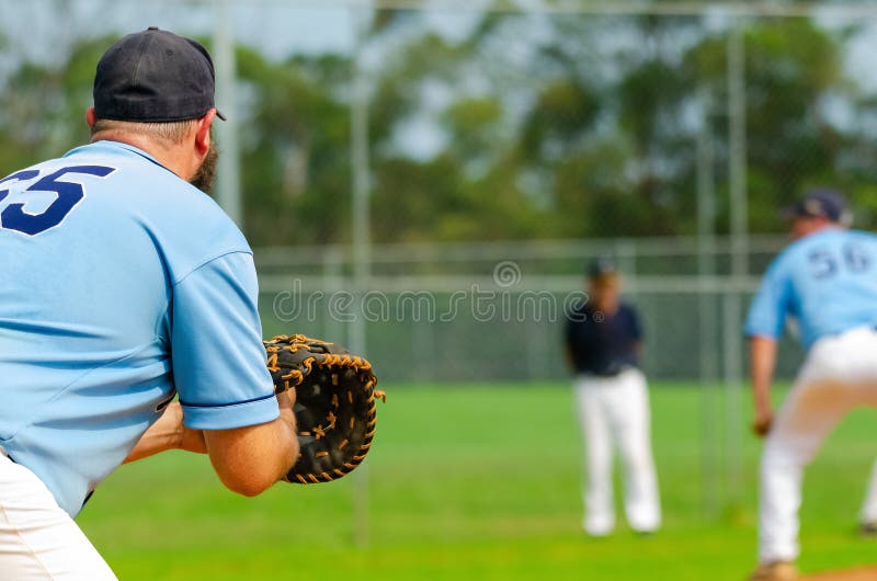 Baseball Game, First Baseman is Getting Ready To Catch a Ball from a ...